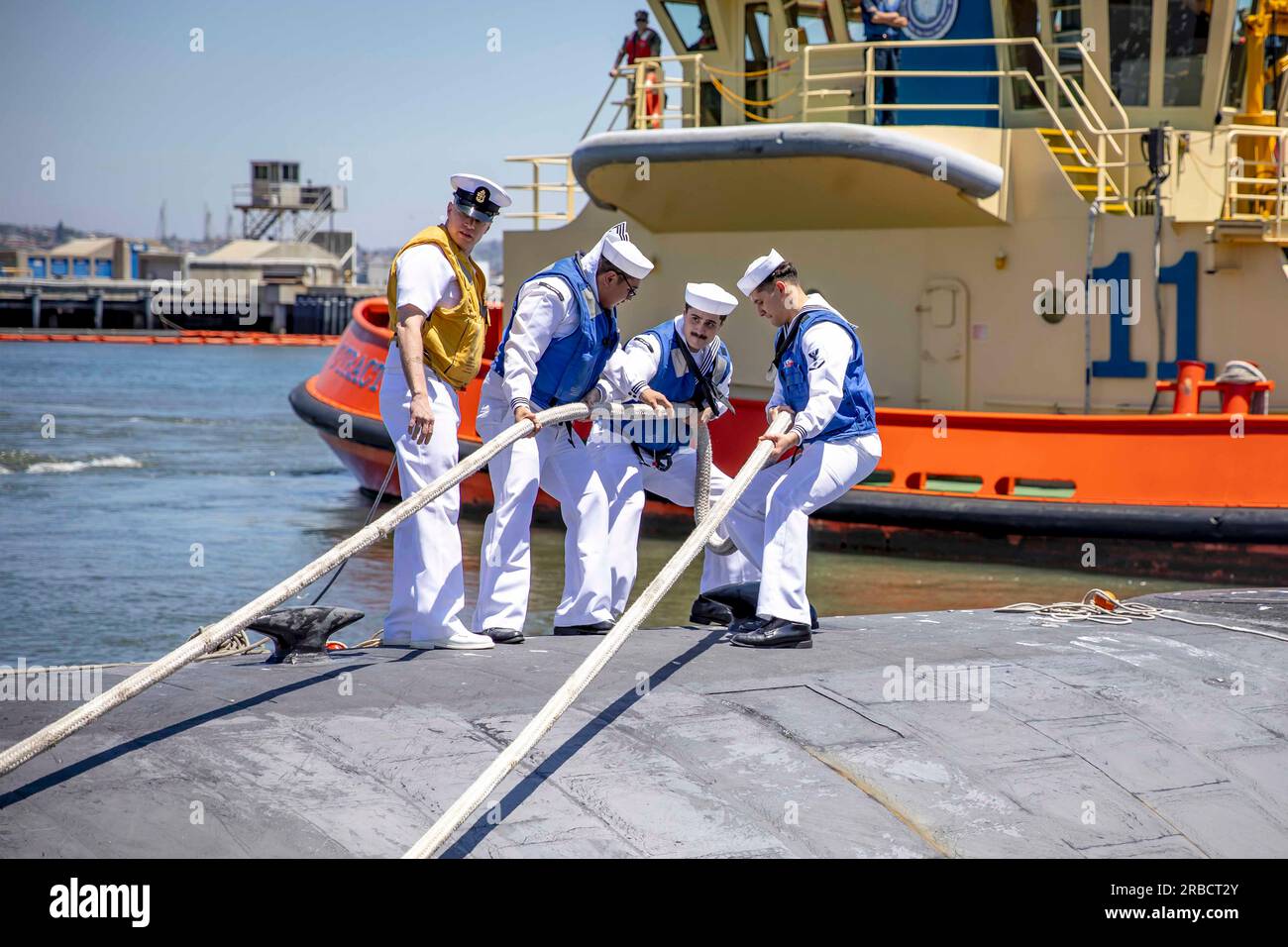 California, USA. 5th July, 2023. Sailors aboard the USS Hampton handle ...