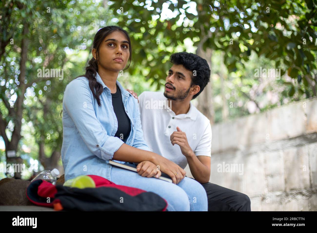 Young college couple having relationship problem on campus Stock Photo ...