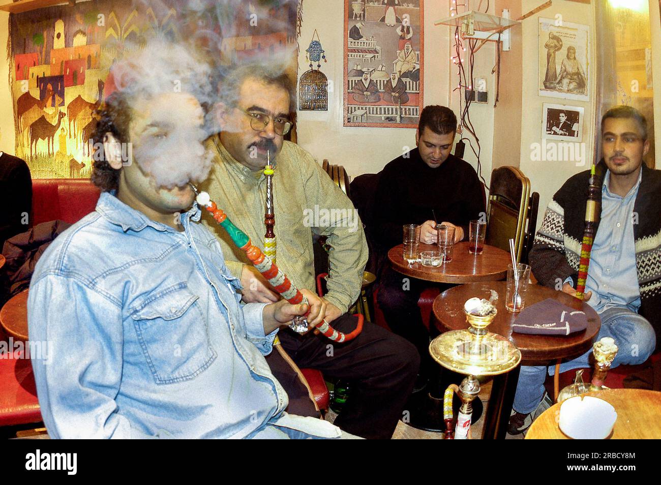 PARIS, France - Arab Men Sitting inside Smoking Pipe in "Oum Kalthoum ...