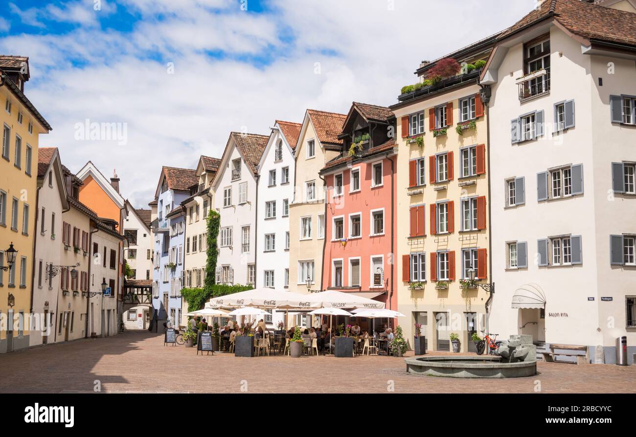 People sitting outside a restaurant in Arcas square, Chur, Switzerland ...