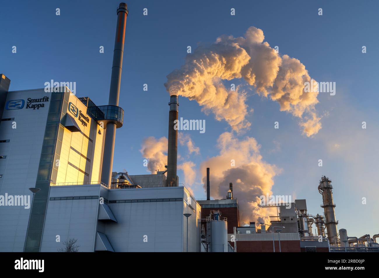 Factory smokestacks from paper industry Smurfit Kappa in action Stock ...