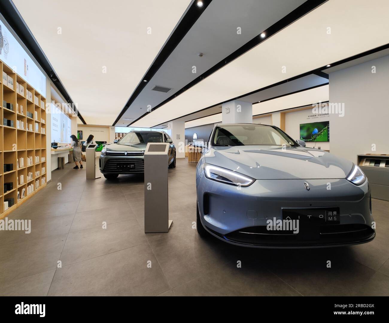 Seres Aito M5 and M7 EV cars displayed at Huawei retail store in ...