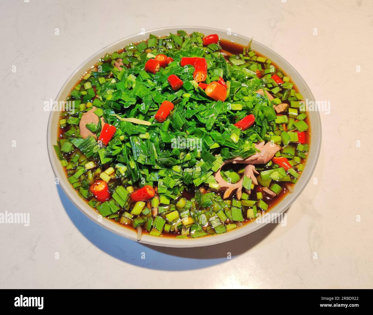 fresh braised pig's kidney with green Chinese leek and red peppers in ...