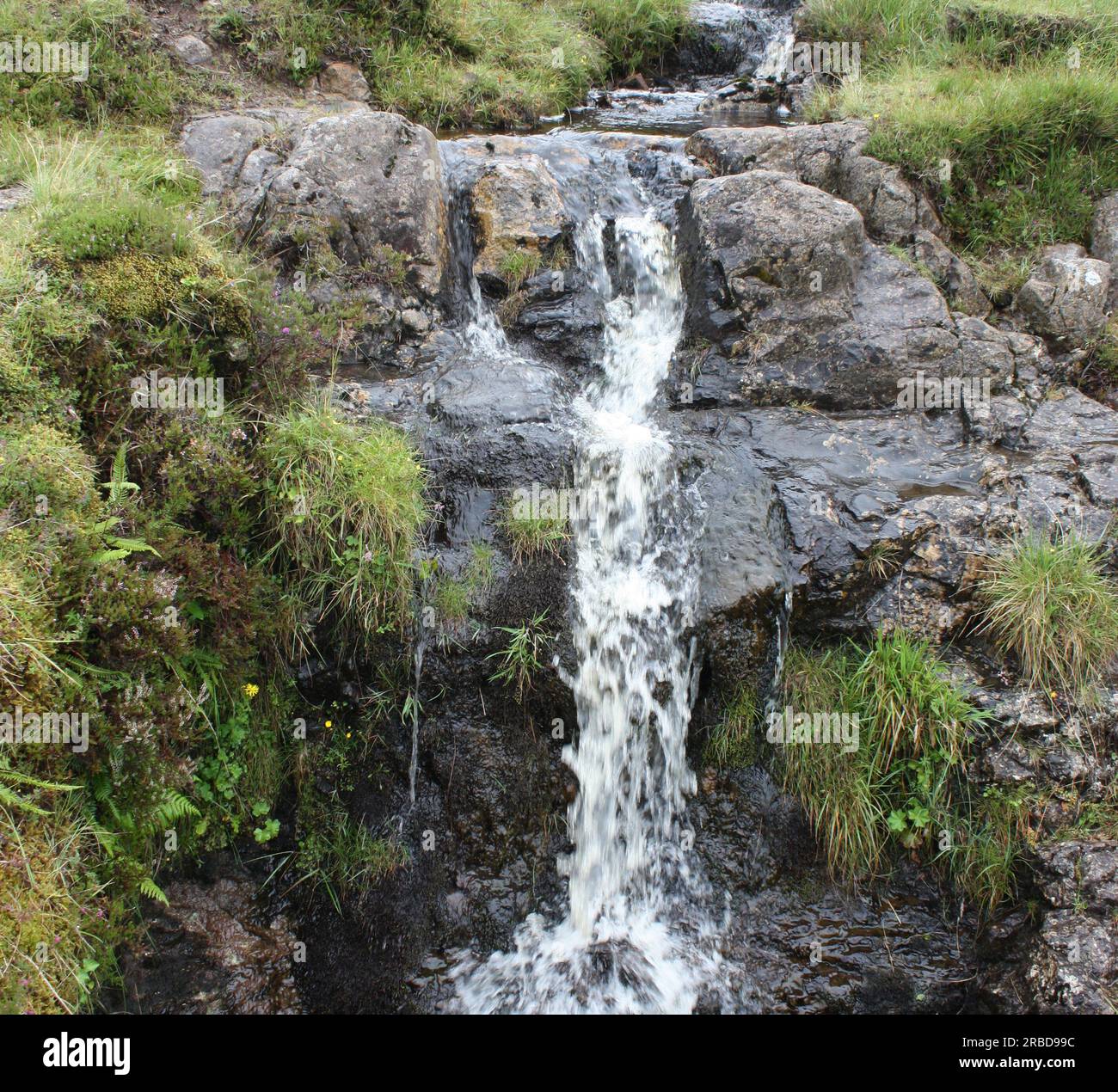 A Clear Pretty Waterfall on a Rocky Mountainside Stock Photo - Alamy