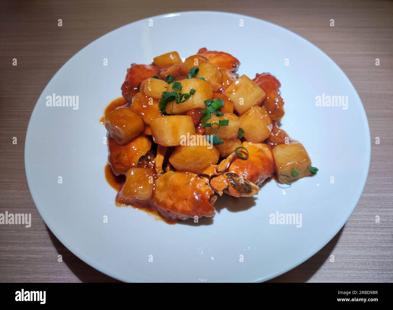 fresh rice cakes scrambled with crabs in the white plate ready for ...