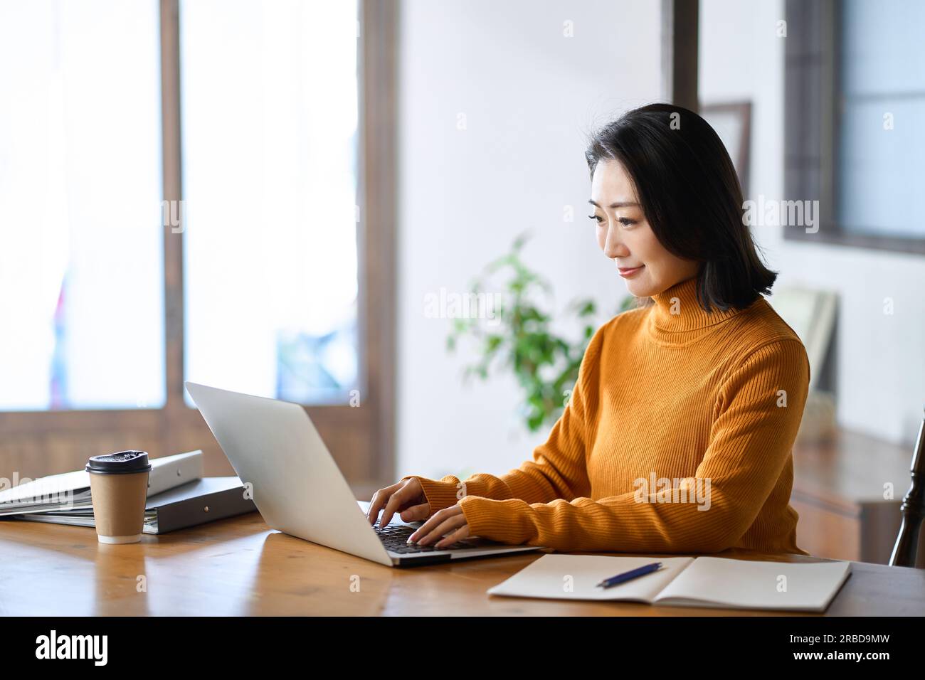 Asian female typing text hi-res stock photography and images - Alamy