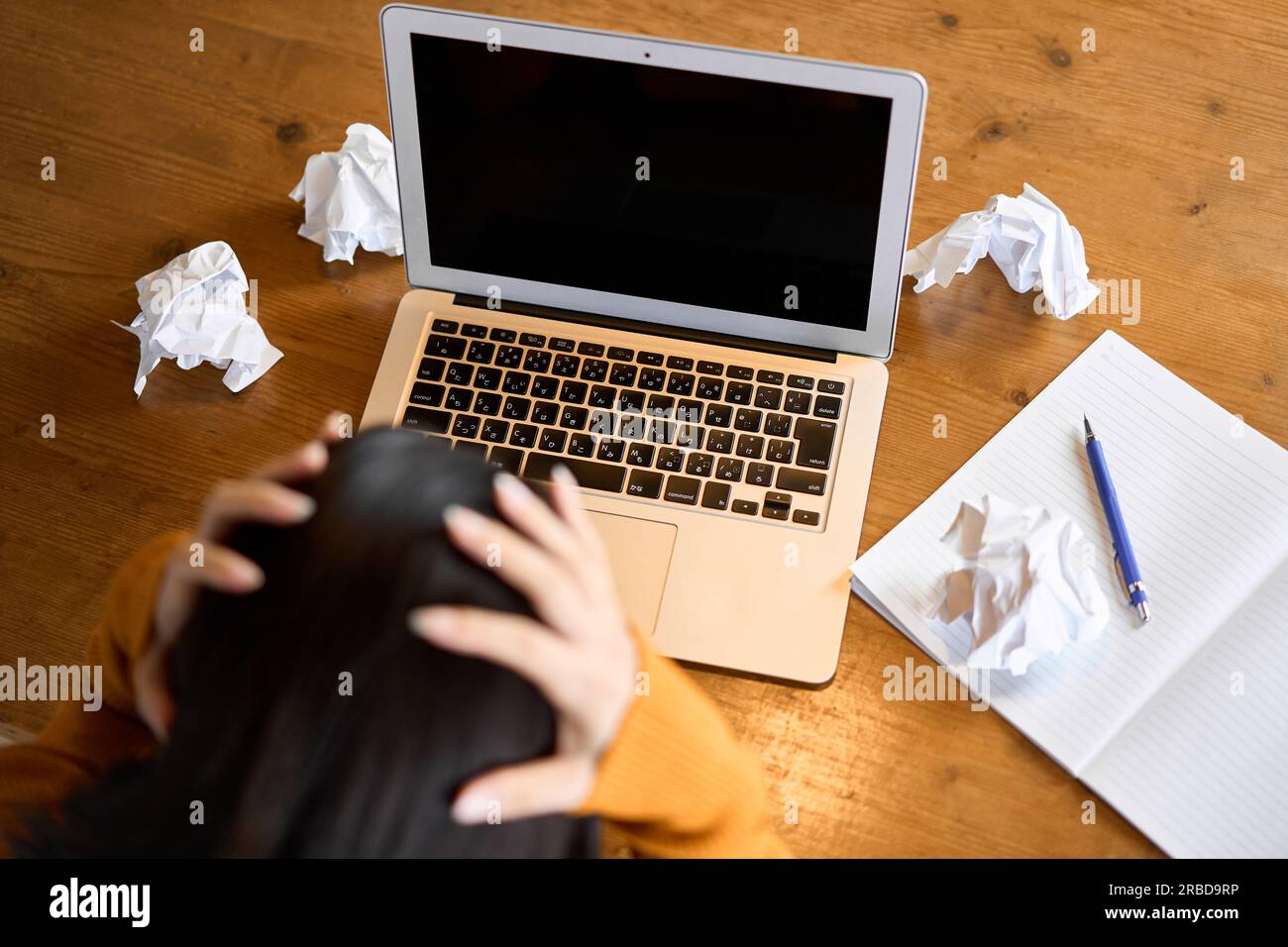 A woman stuck in computer work Stock Photo - Alamy