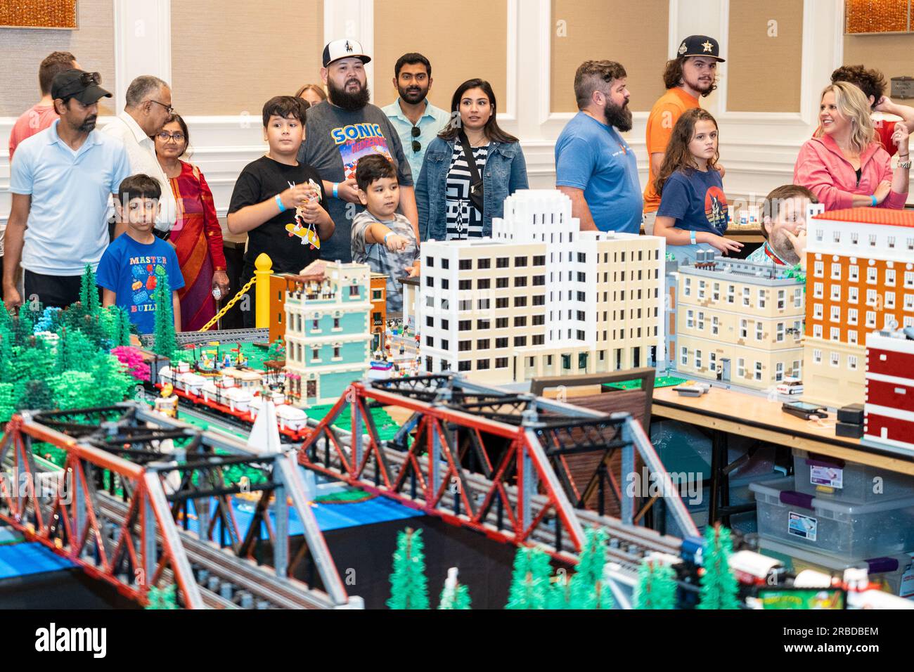 Houston, USA. 8th July, 2023. People look at a city model built with ...