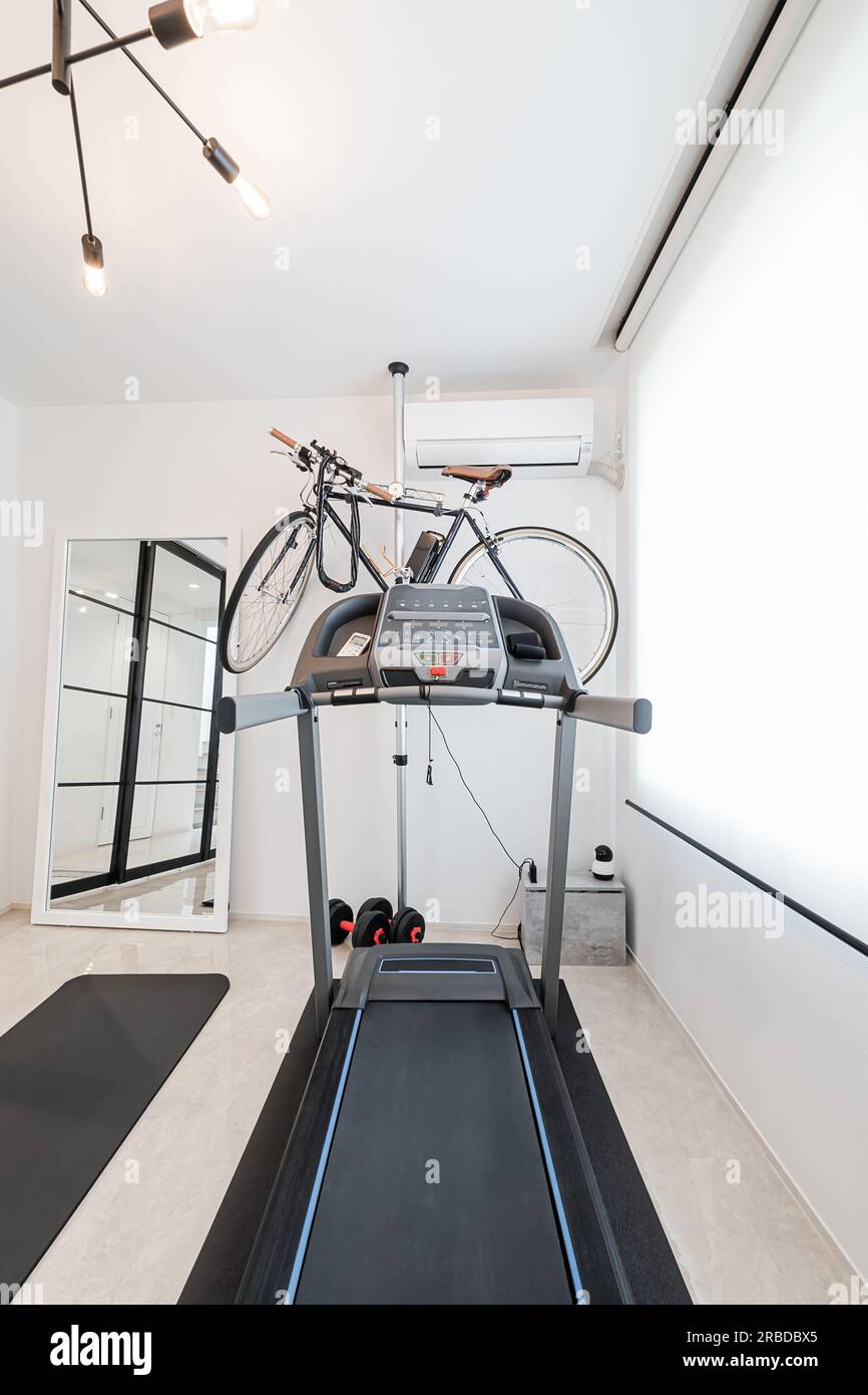 Treadmill in home training room Stock Photo - Alamy