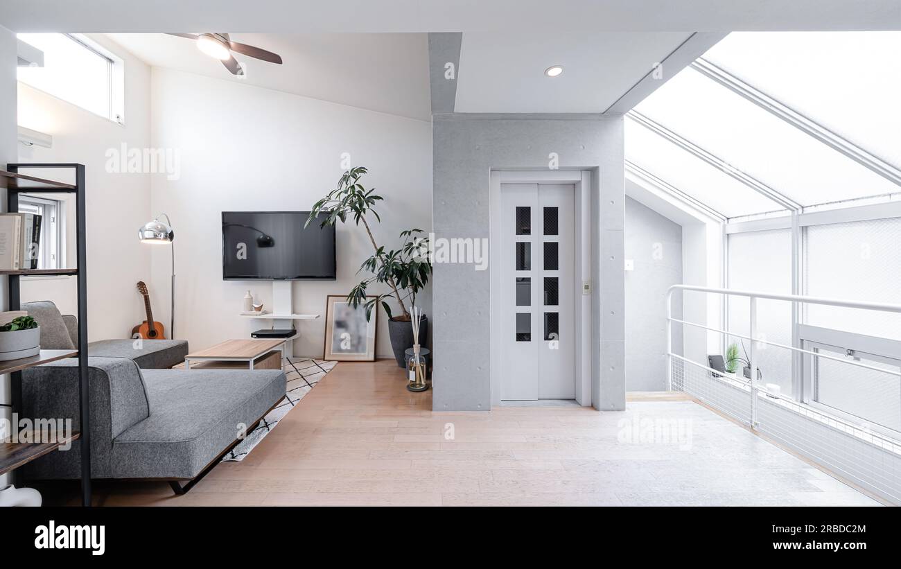 Modern style living room with elevator Stock Photo - Alamy