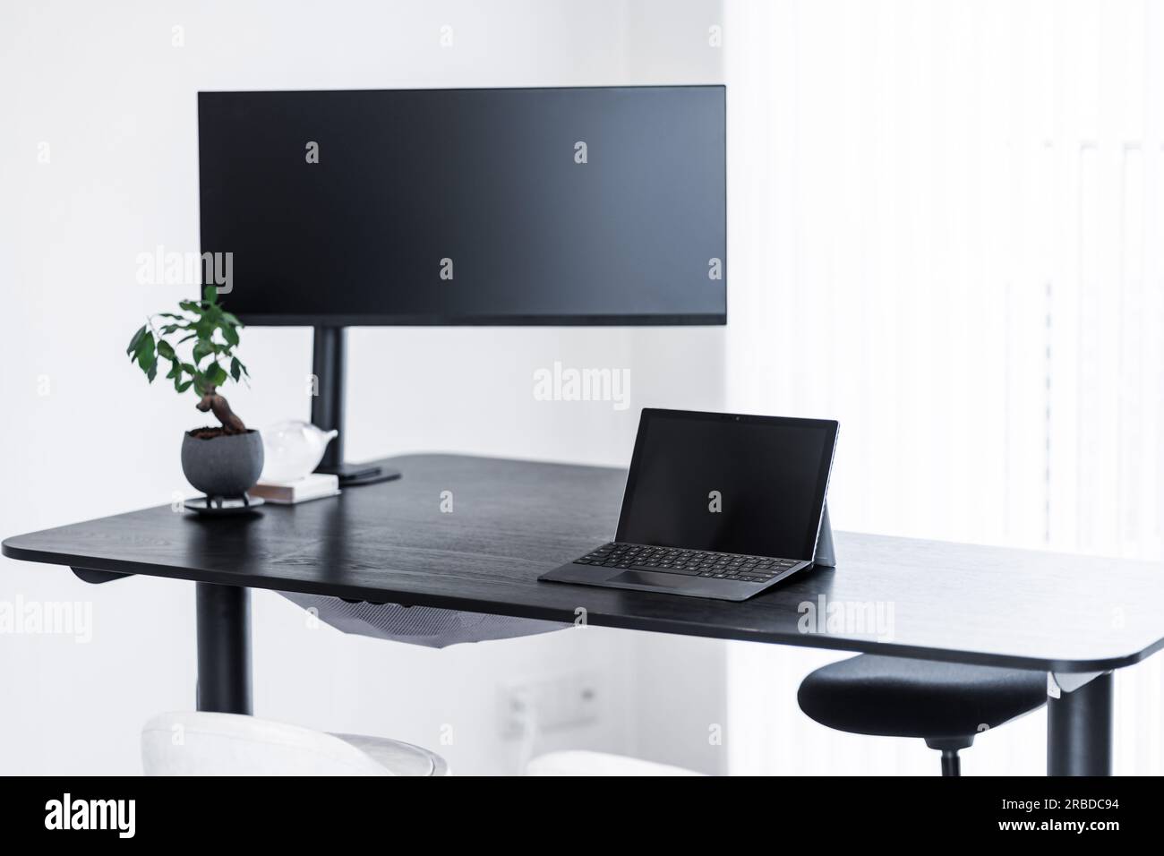 Work environment with laptop and external monitor Stock Photo - Alamy