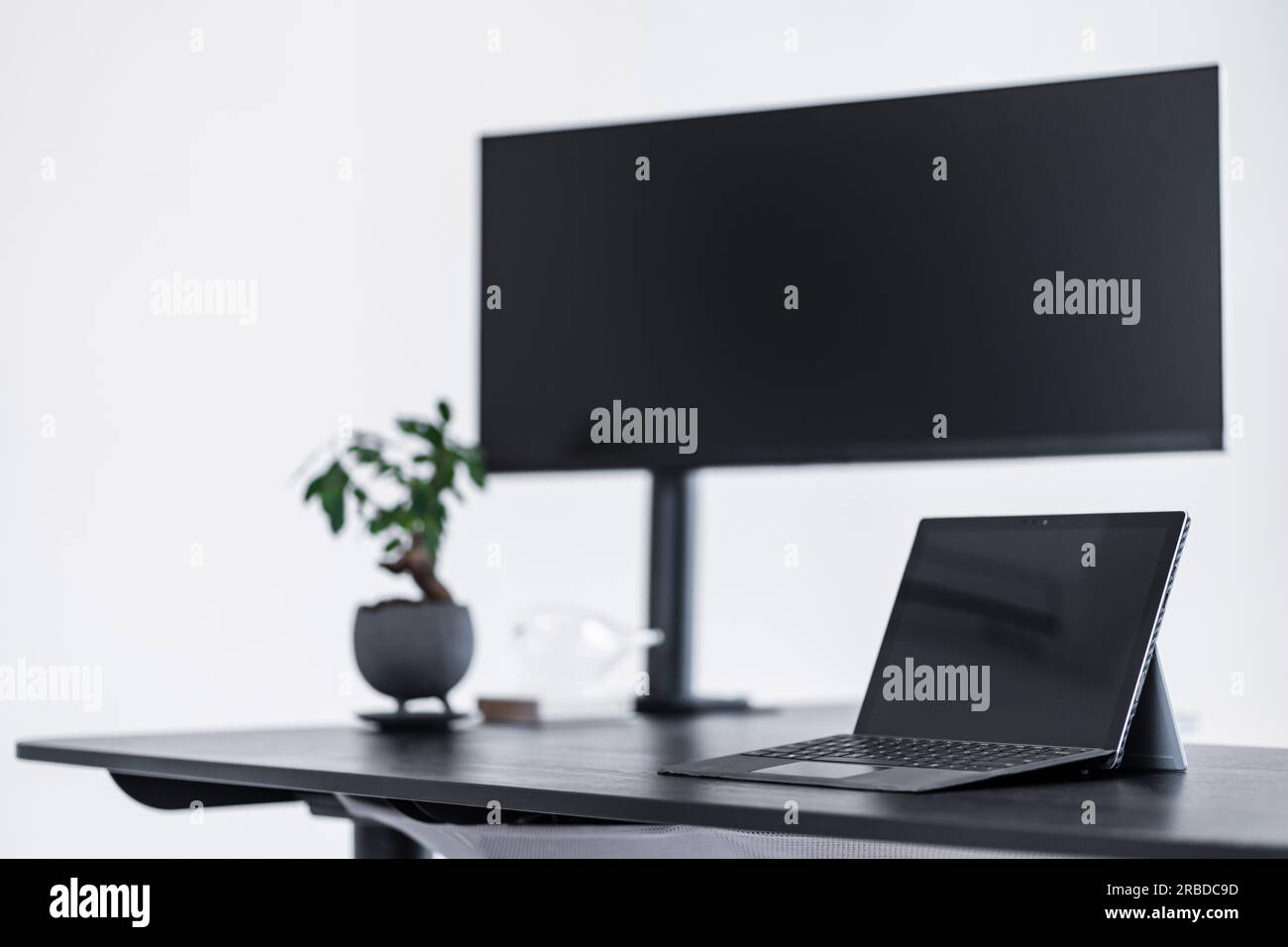 Work environment with laptop and external monitor Stock Photo - Alamy