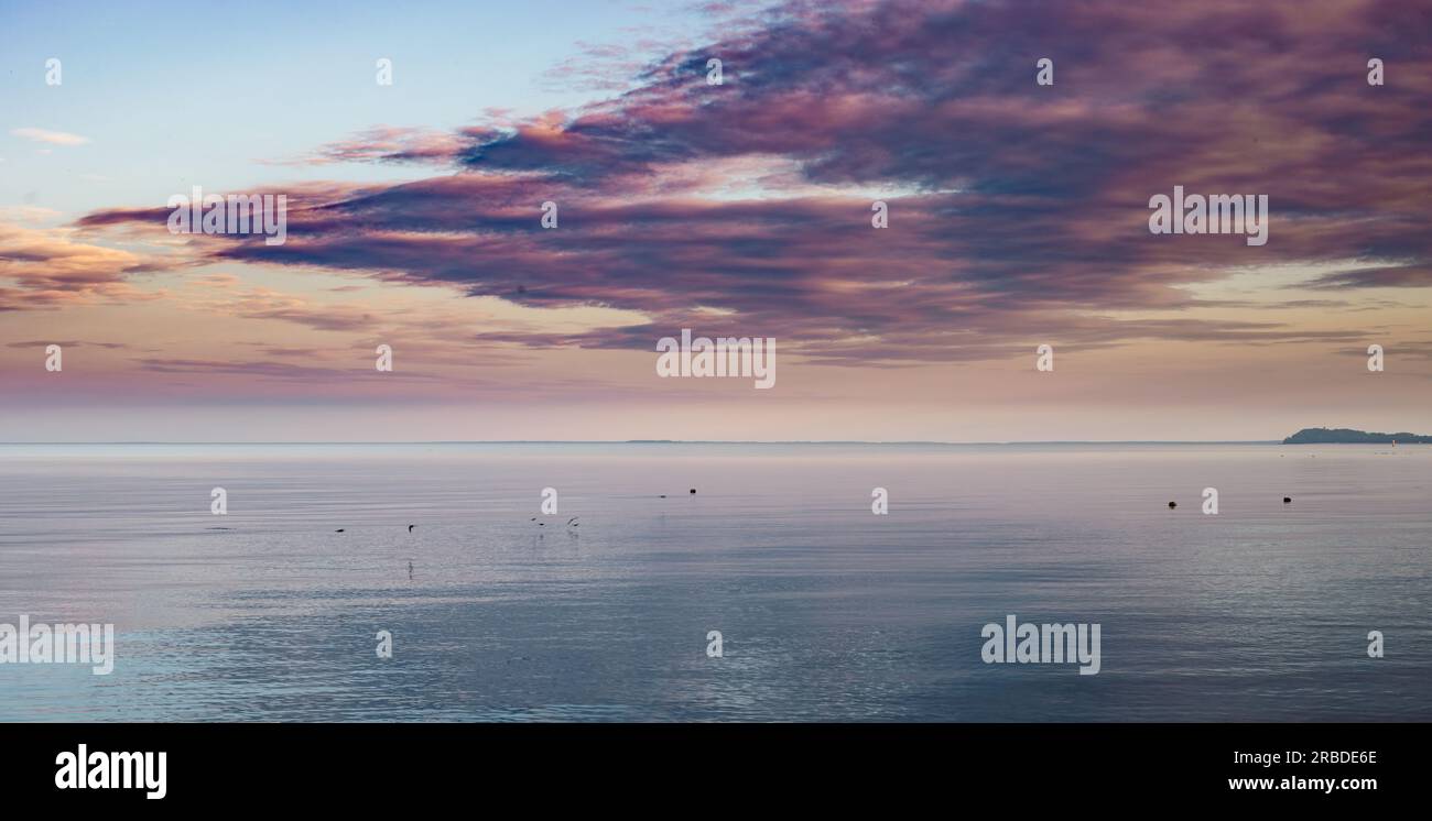 A quiet sunset at the sea Stock Photo - Alamy