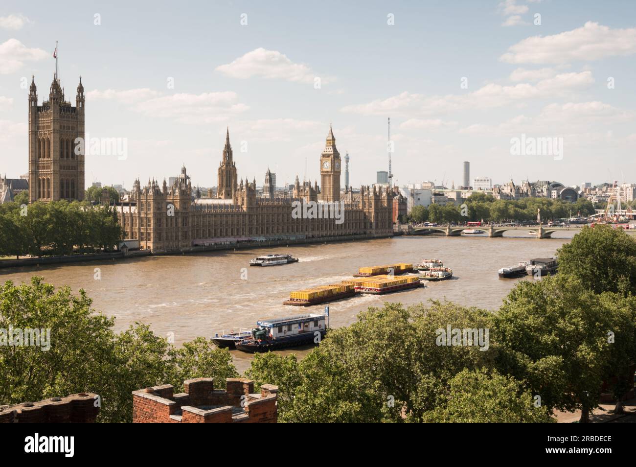 Cory tug boats transporting waste containers past the Houses of ...