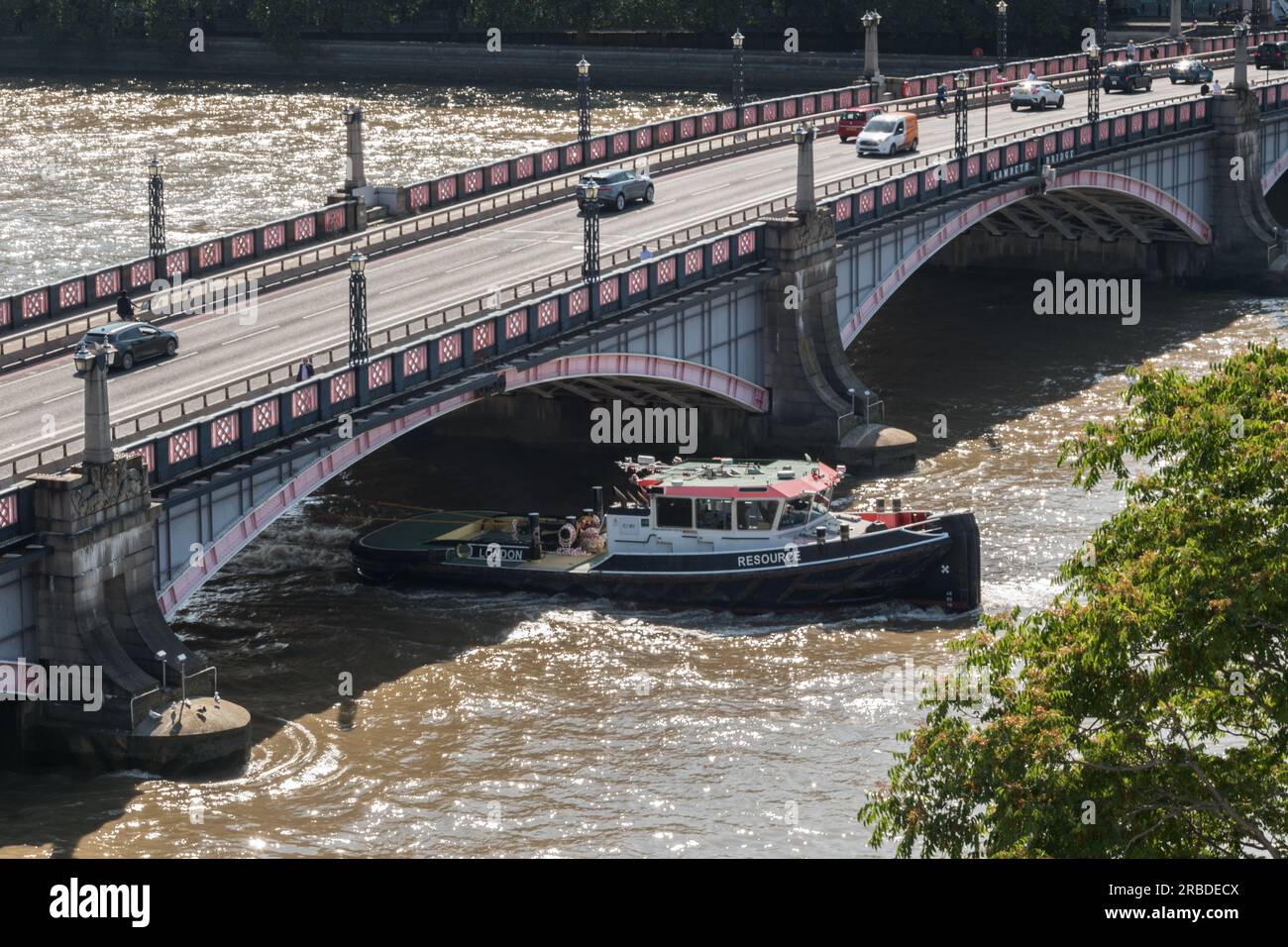 Resource, a Cory tug boat pulling industrial waste containers ...