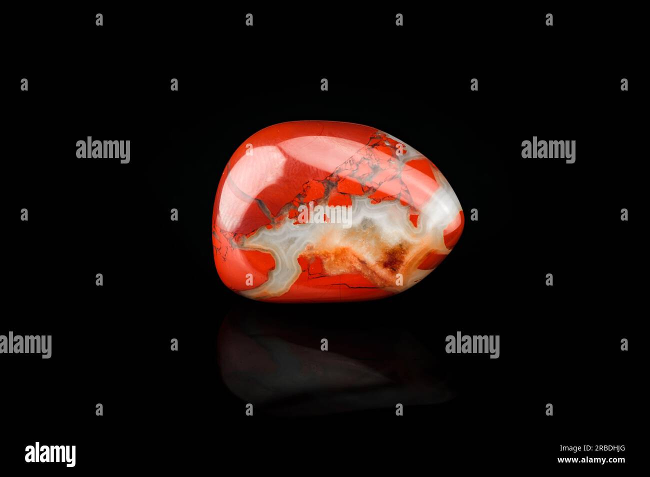 red jasper isolated on black background. macro detail texture. close-up ...