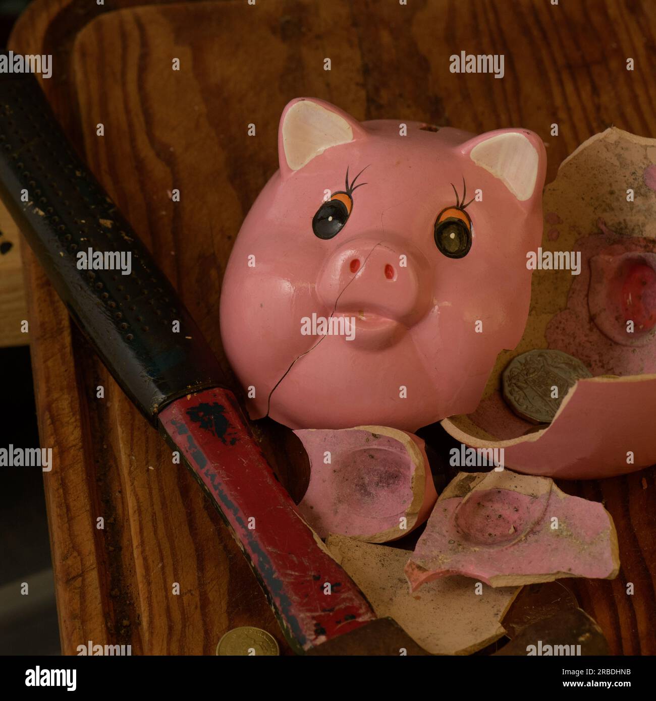 Breaking Open the Piggy Bank Stock Photo - Alamy