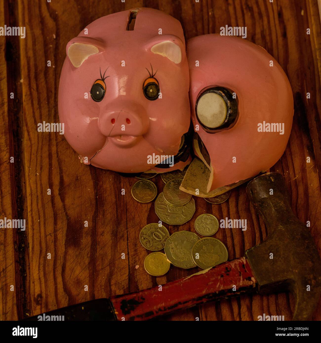 Breaking Open the Piggy Bank Stock Photo - Alamy