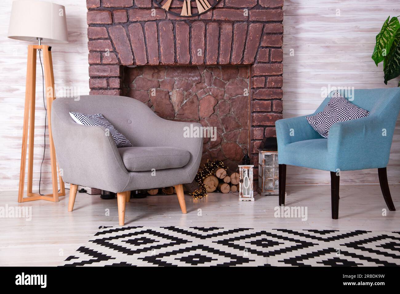 Comfortable reading chair in the room near the fireplace. Furniture of ...