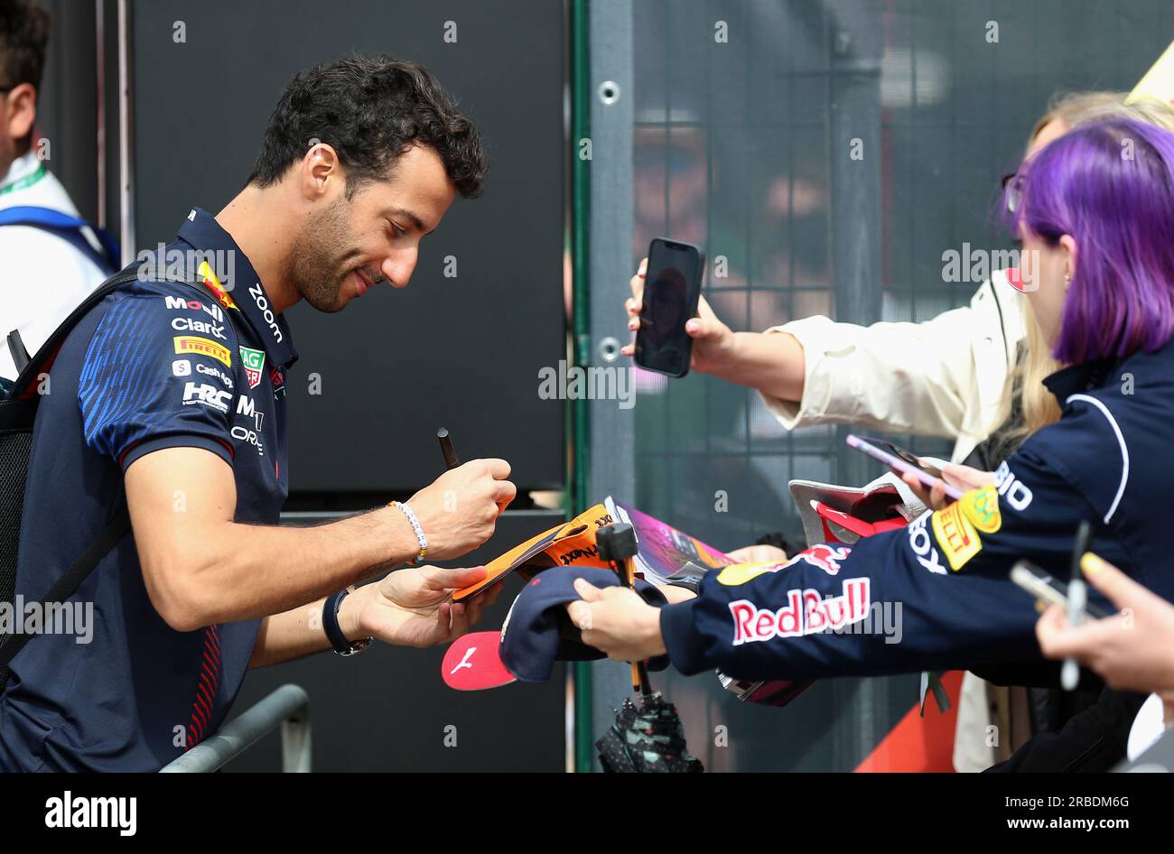 Red Bull reserve driver Daniel Ricciardo signs autographs for fans ...