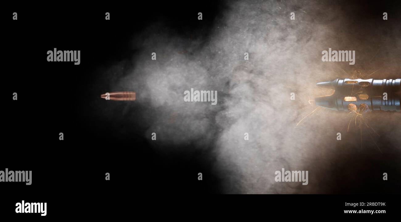 Muzzle of a gun that just released a bullet with smoke and sparks Stock ...