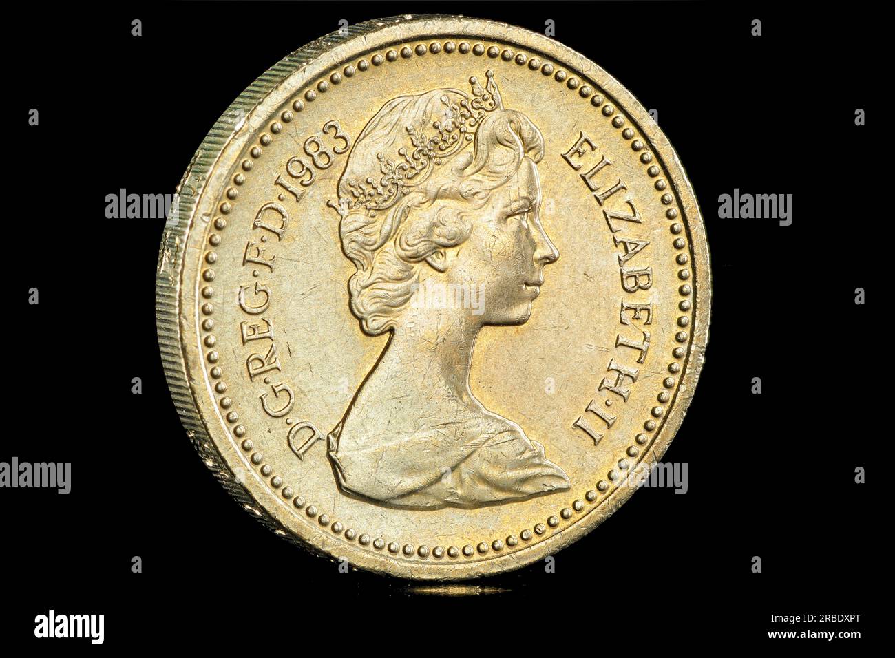 The very first United Kingdom One Pound Coin issued in 1983. The front bears the portrait of ...