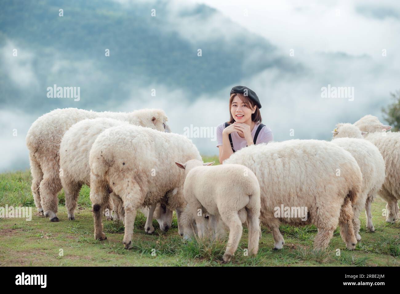 Female asian farmer feeding animal hi-res stock photography and images - Alamy