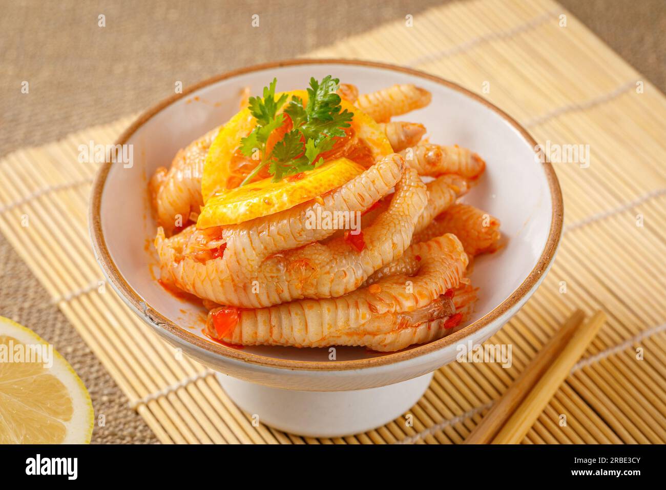 Chicken feet with hot Pepper on retro dark background.Delicious and ...