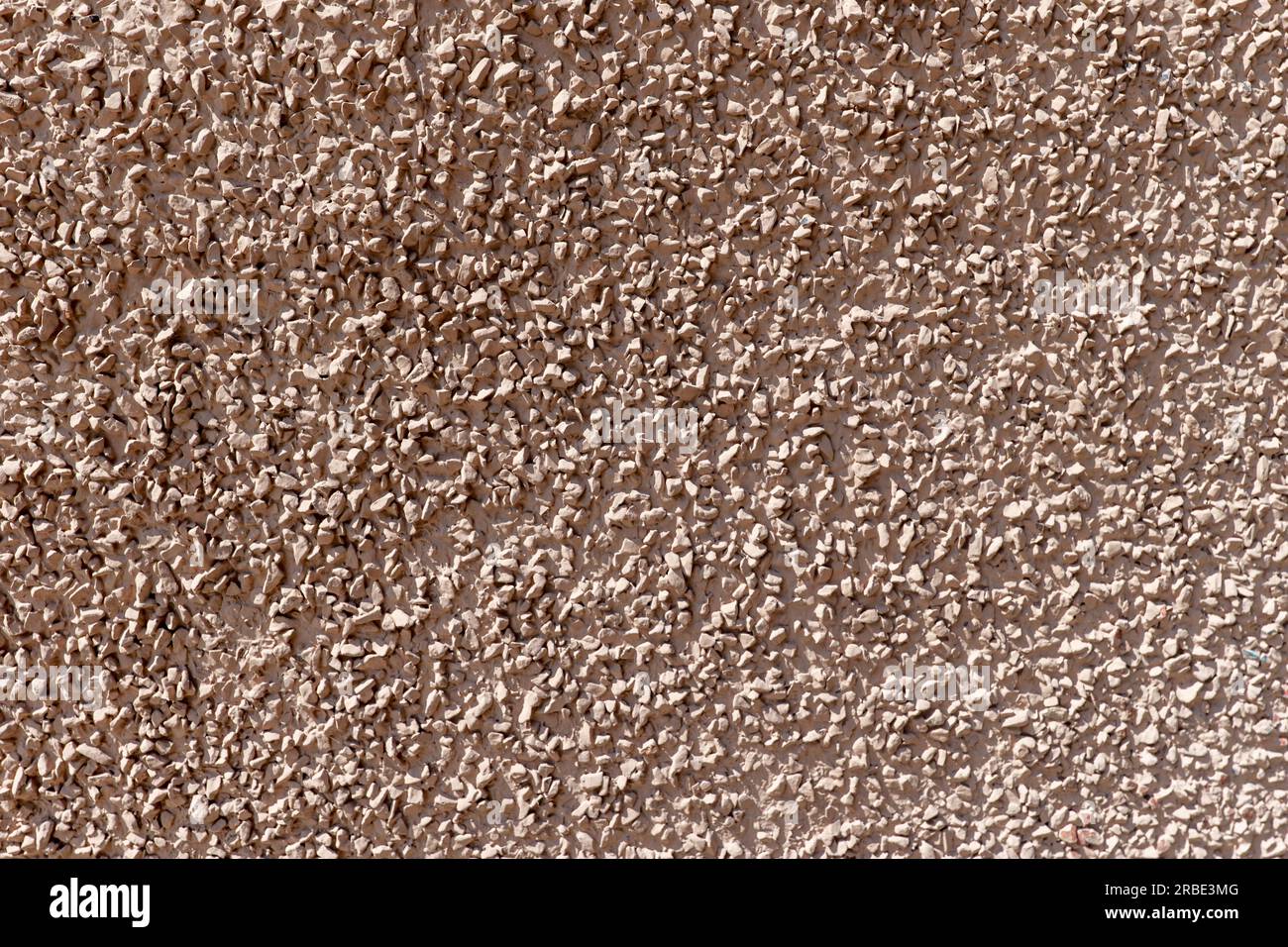 An old stone wall with small pointed stones painted in pink. vector ...