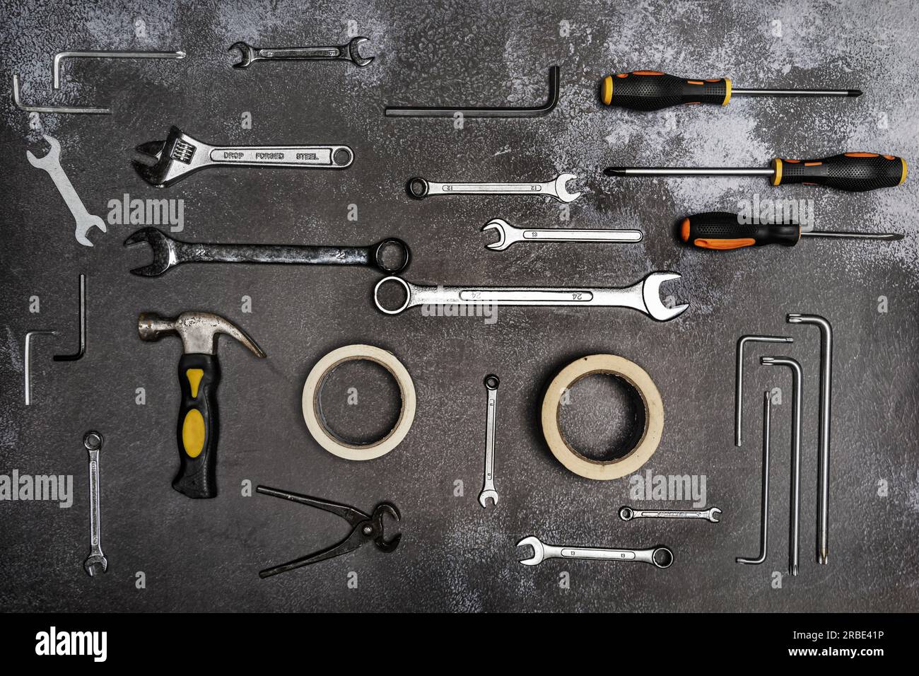 open-end wrenches, Phillips screwdrivers, masking tape, hammers, and ...