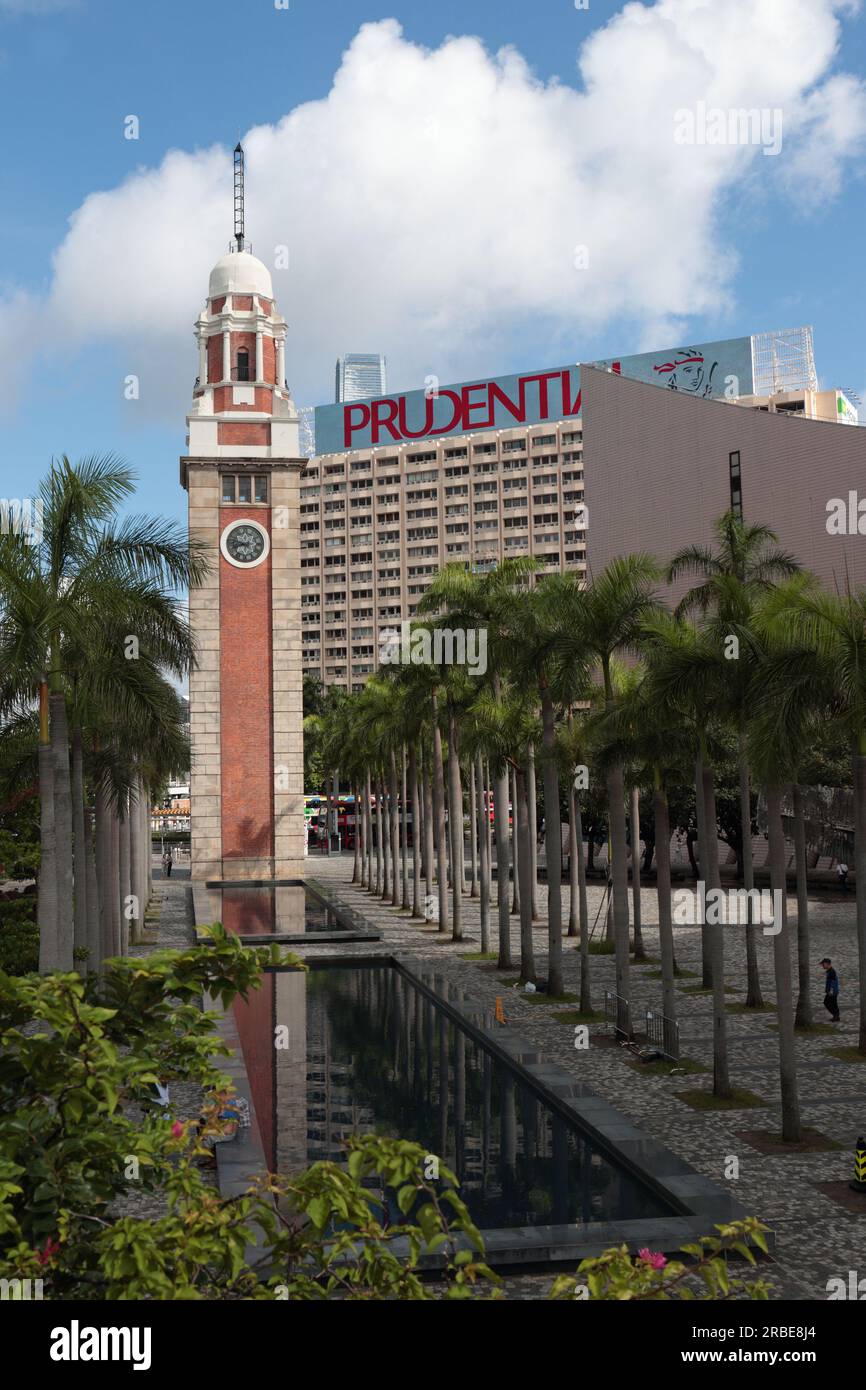 Vertical view of KCR Terminal Clock Tower with Palm Trees, fountain ...