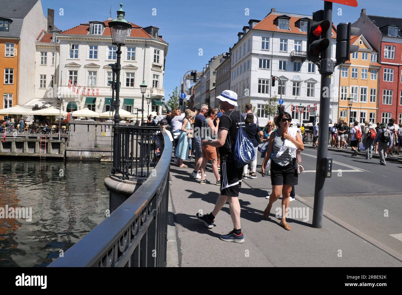 09 July 2023/ Travellers enjoy summer sun shine day at Nyhavn canal in ...
