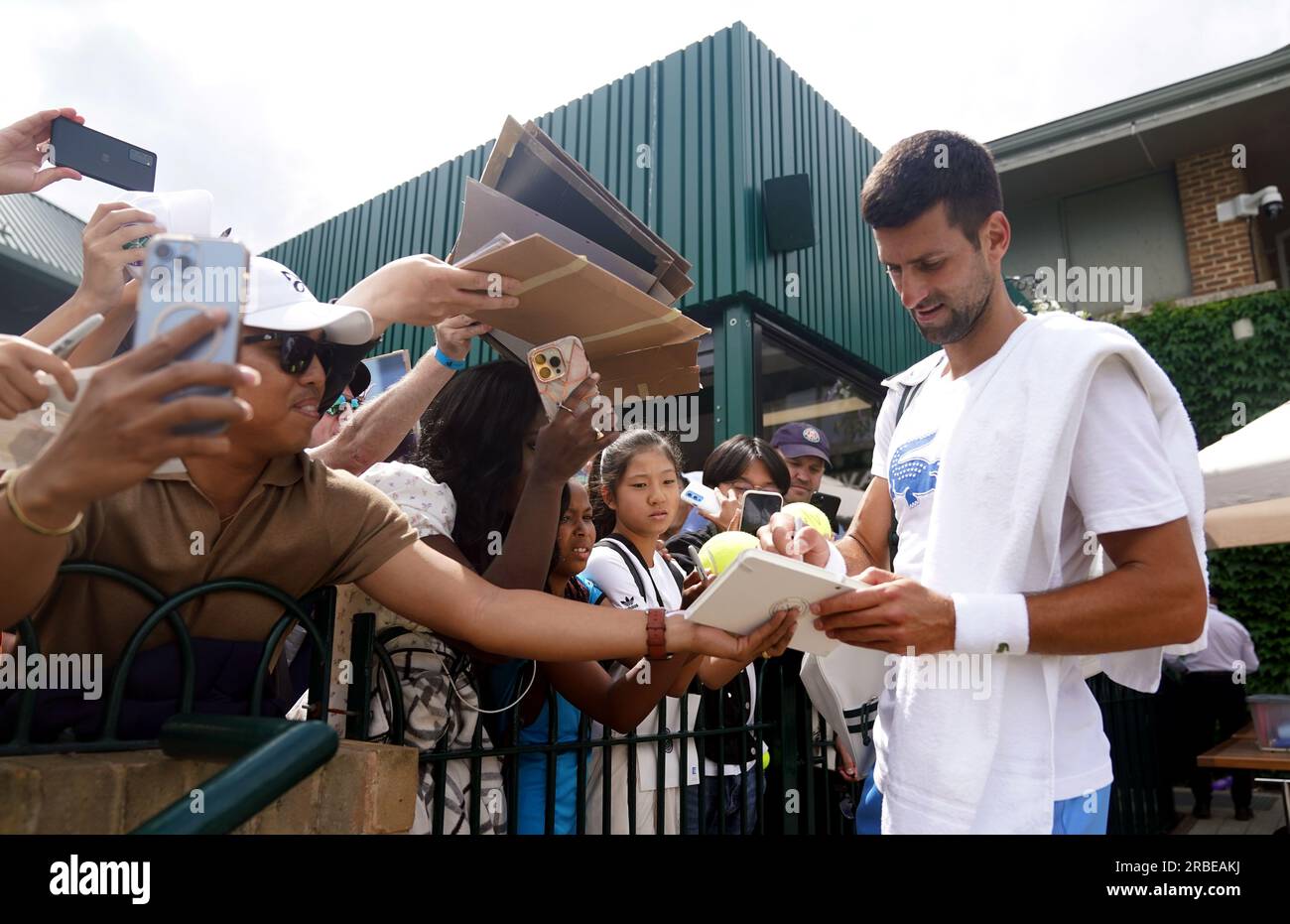 Novak Djokovic signs autographs for fans on day seven of the 2023 ...