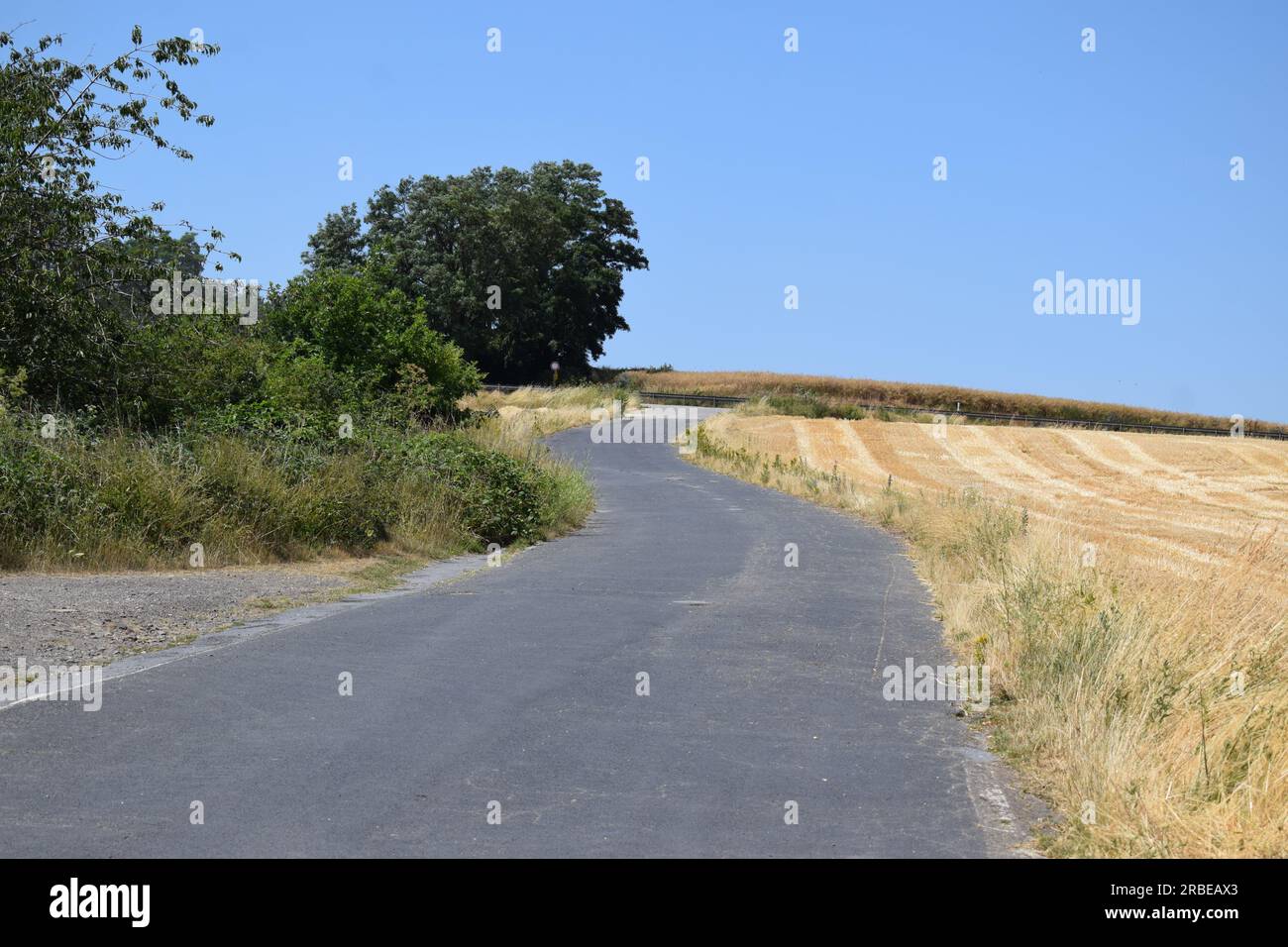 road to nowhere ending at a barrier Stock Photo - Alamy