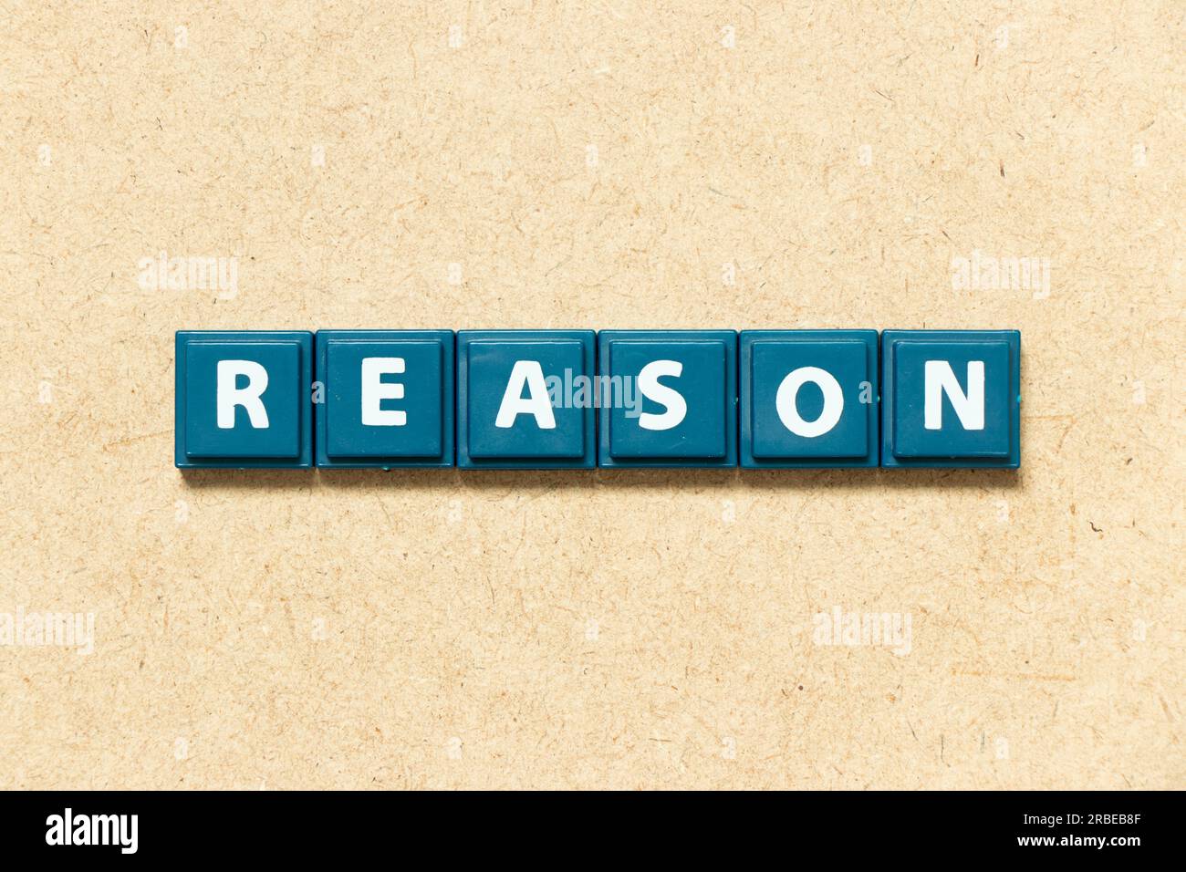 Tile alphabet letter in word reason on wood background Stock Photo - Alamy