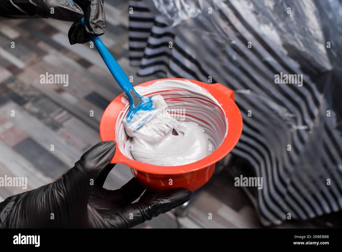 Hair coloring process mixing ingredients brush paint container dye ...