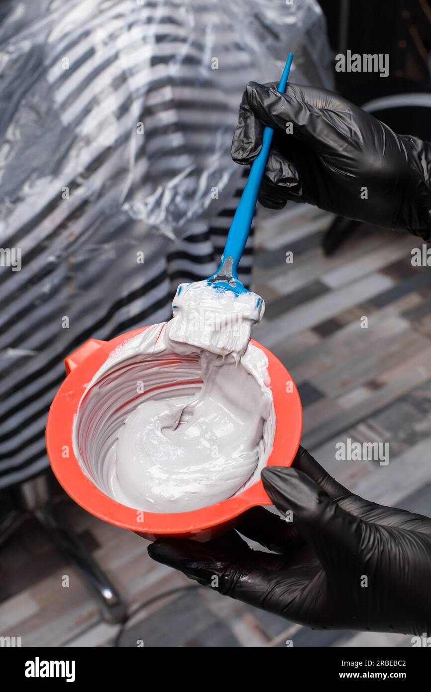 Hair coloring process mixing ingredients brush paint container dye ...