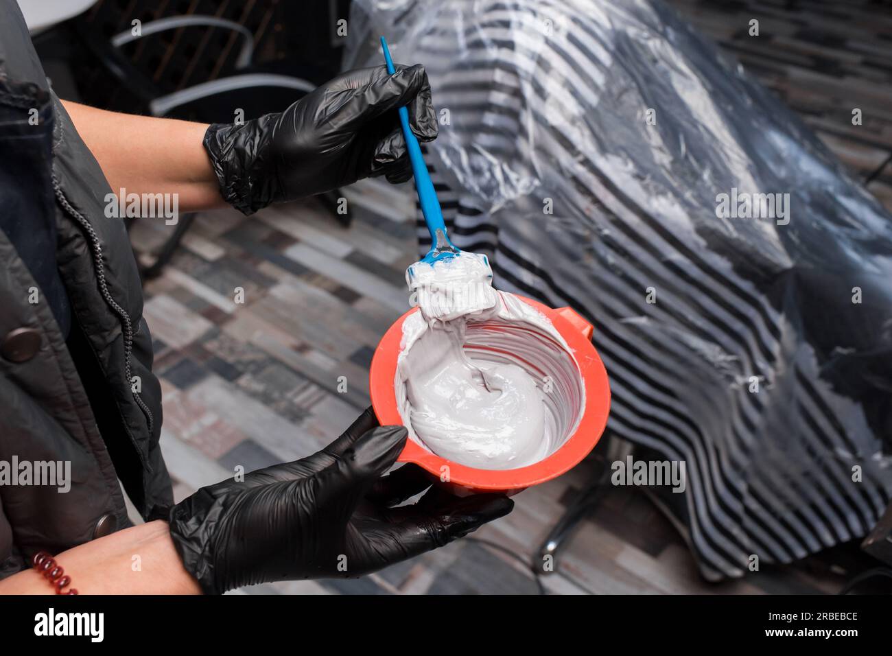 Hair coloring process mixing ingredients brush paint container dye ...