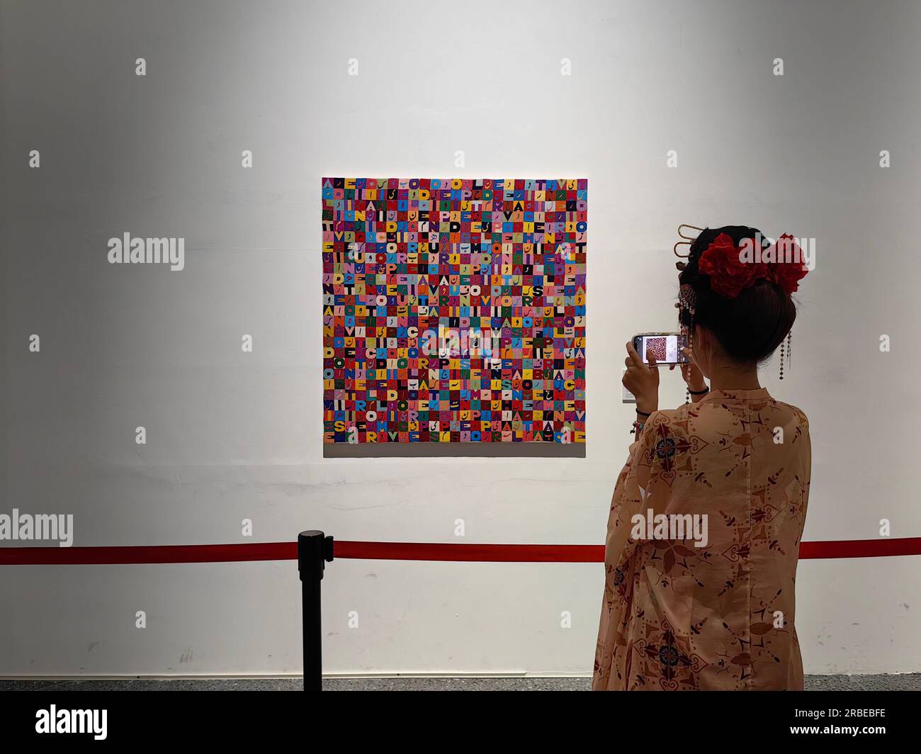 Xi'an, China's Shaanxi province. 4th July, 2023. A visitor takes photos of an exhibit during an ...