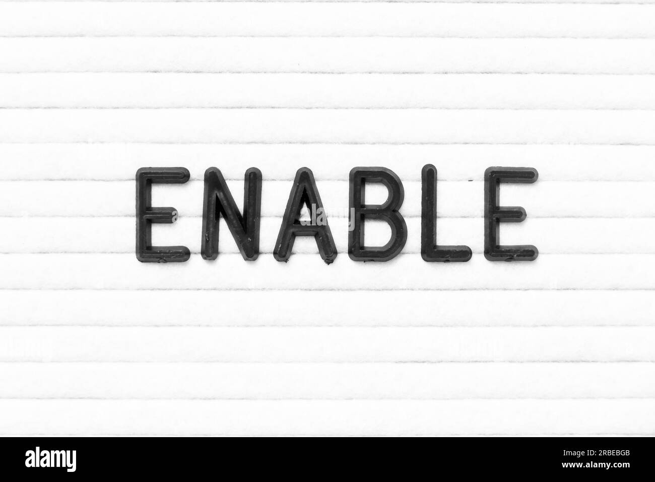 Black color letter in word enable on white felt board background Stock ...