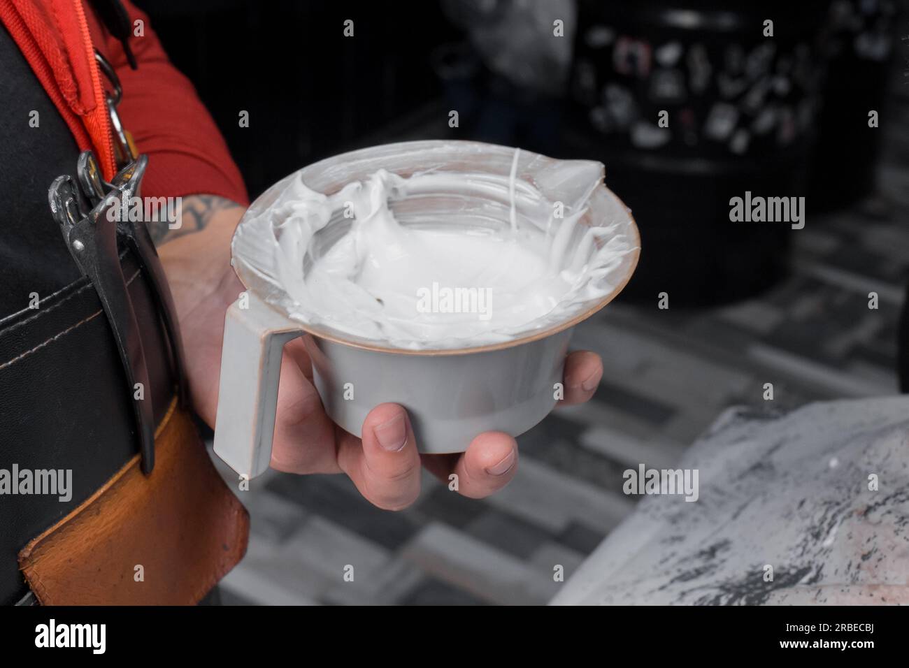 White color dye coloring in a container for dyeing the client's hair at ...