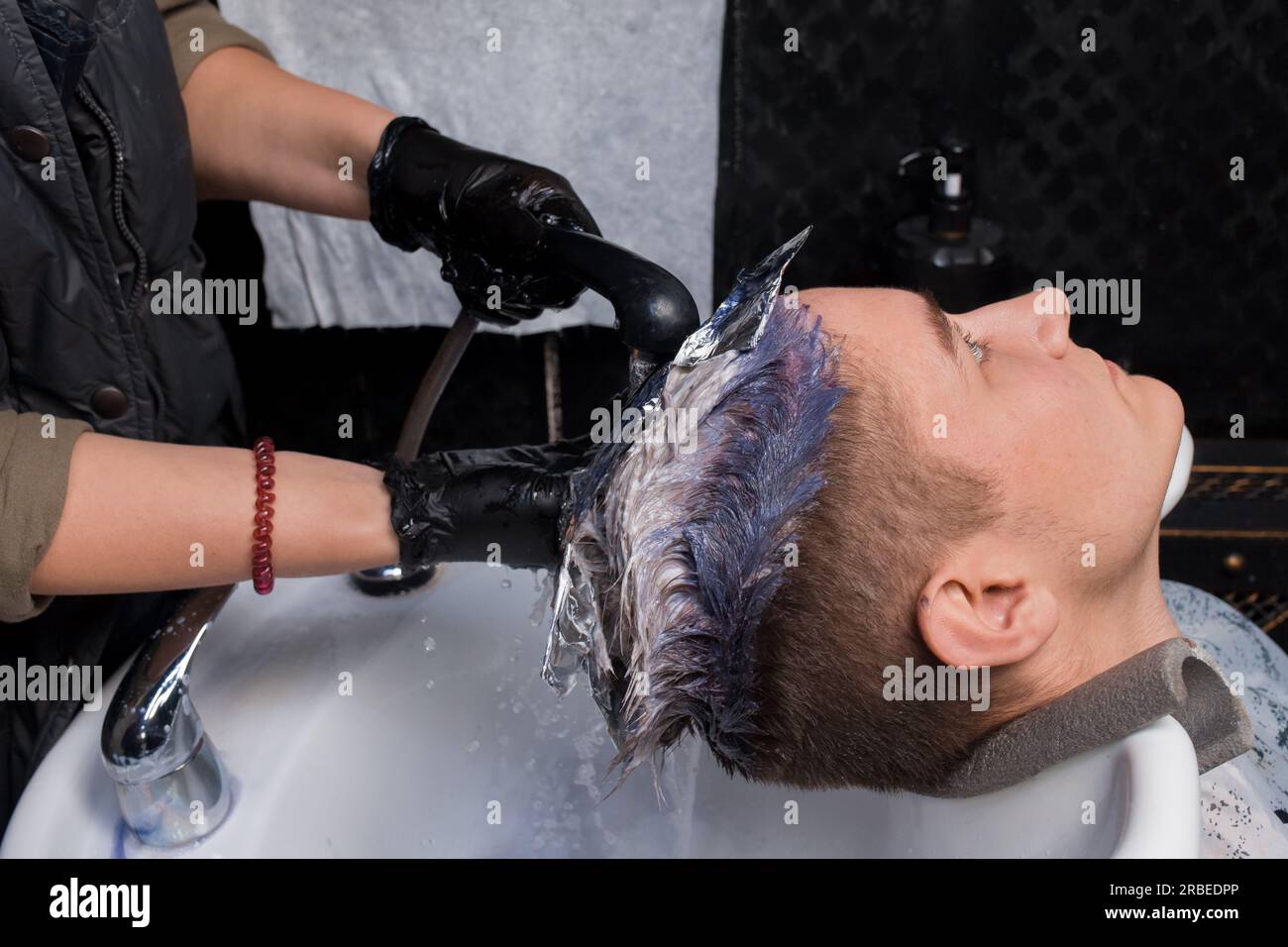 The hands of an experienced craftsman, an employee of the girl's salon ...
