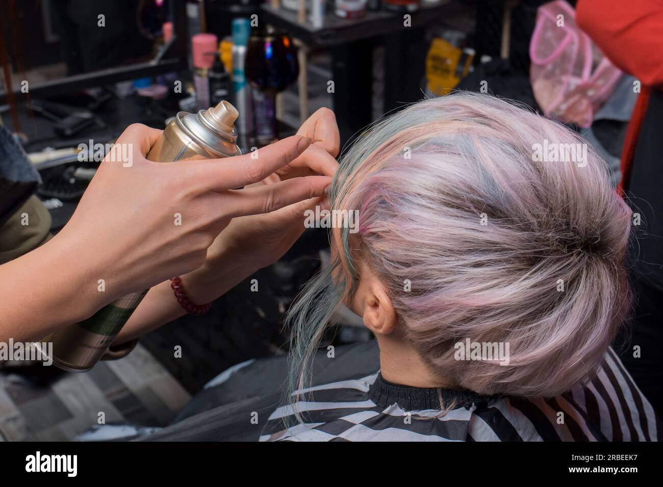 The girl's hands of a professional hairdresser-stylist-make-up artist ...