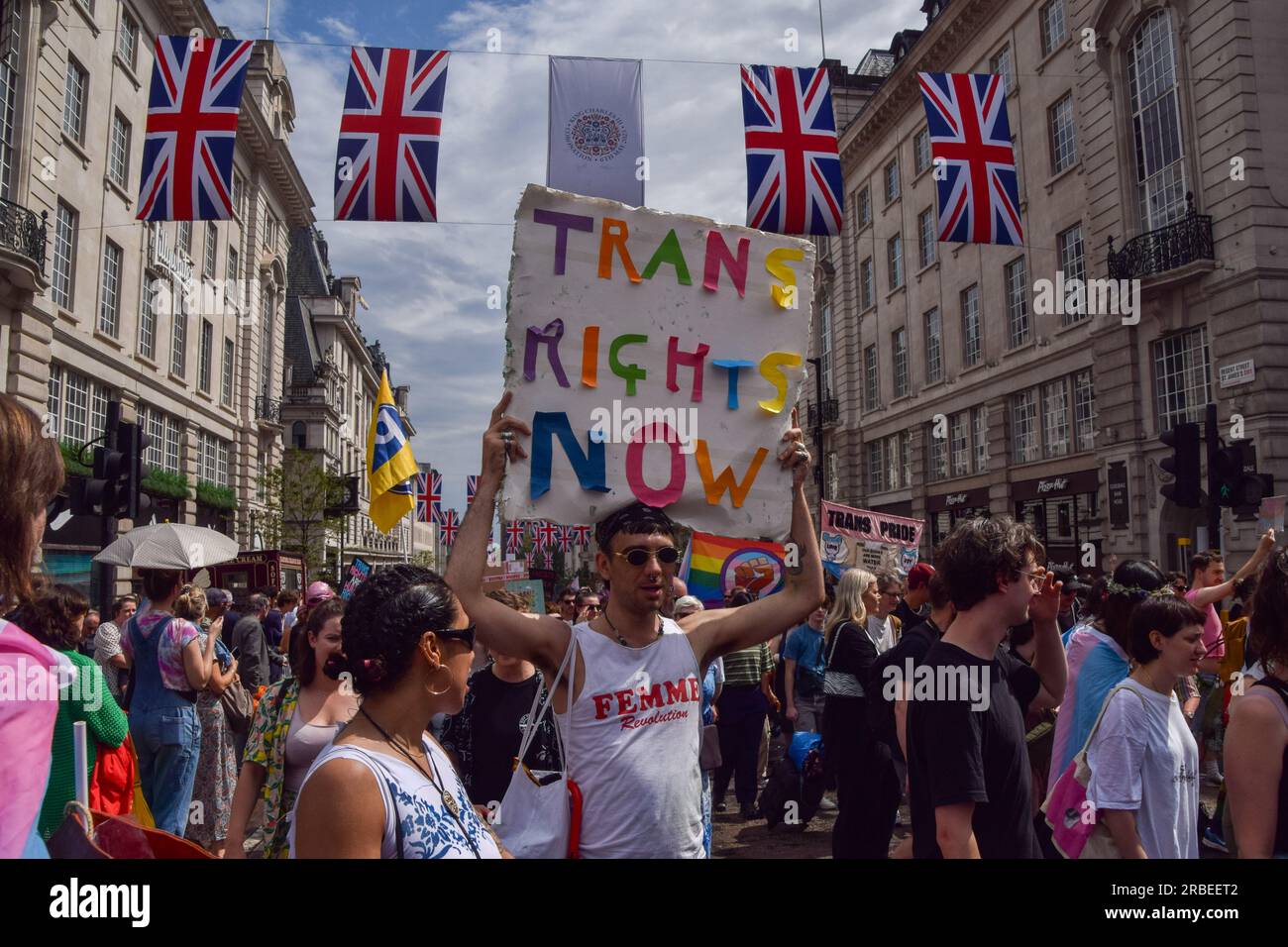 London, UK. 08th July, 2023. A protester holds a 'Trans rights now ...
