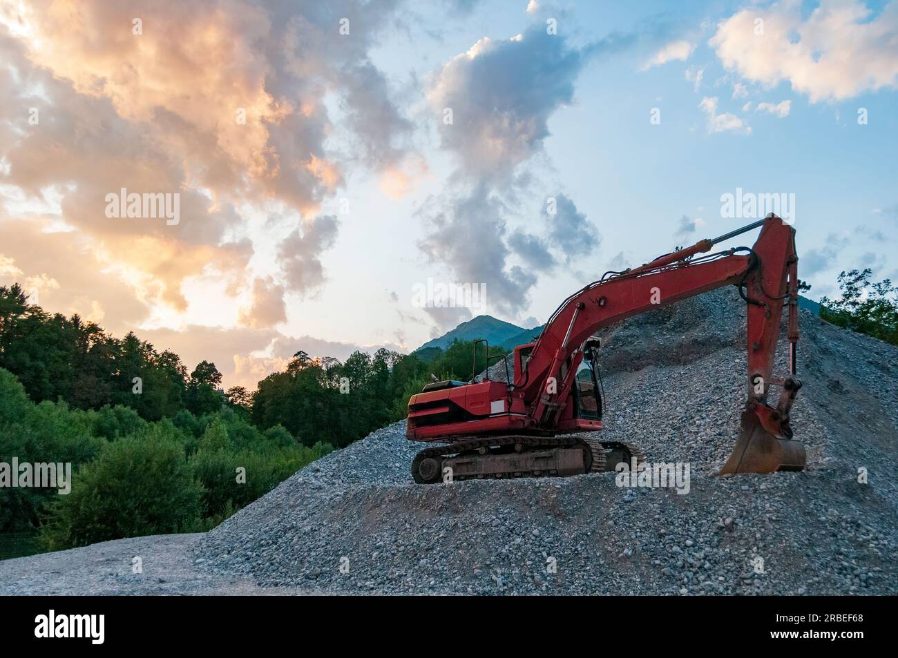 Red excavator on a stone quarry. Industrial machinery Stock Photo - Alamy