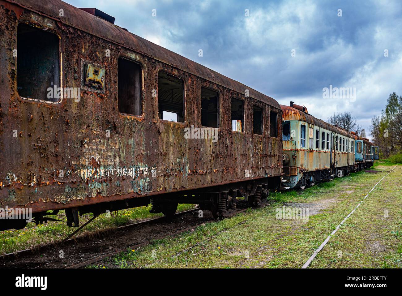 Old rusty passenger railway carriage with electric multiple units ...