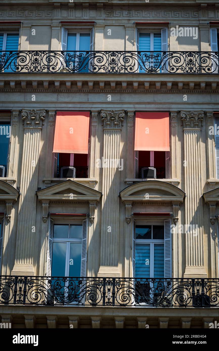 Orange window blinds on a residential apartments building in the 1st ...