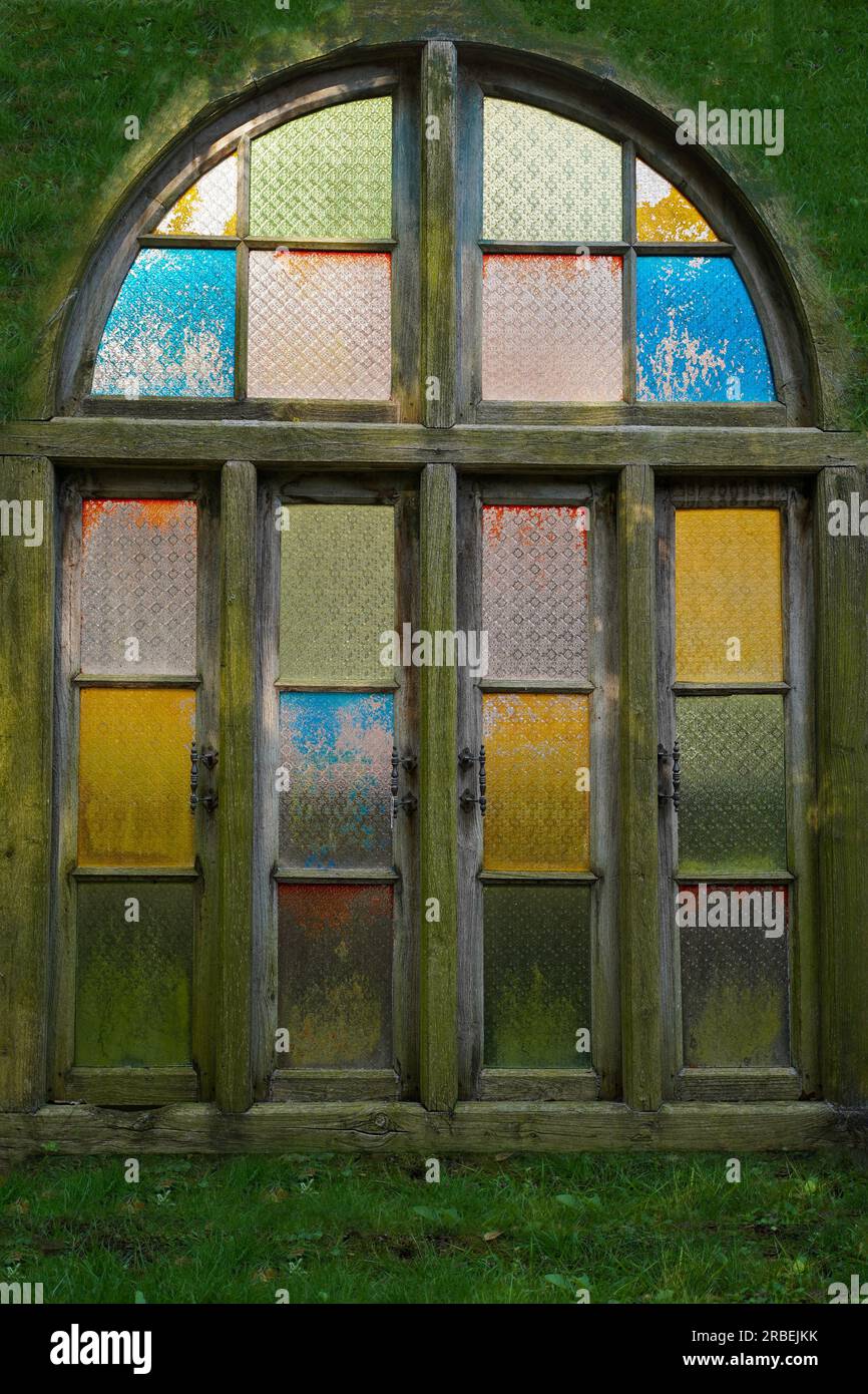 An old mysterious window in the garden. Overgrown Secret Garden Door ...