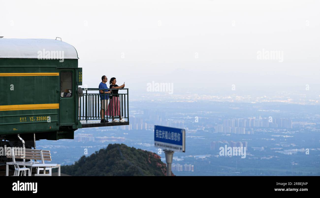 Xinmi, China's Henan Province. 9th July, 2023. Tourists take pictures ...