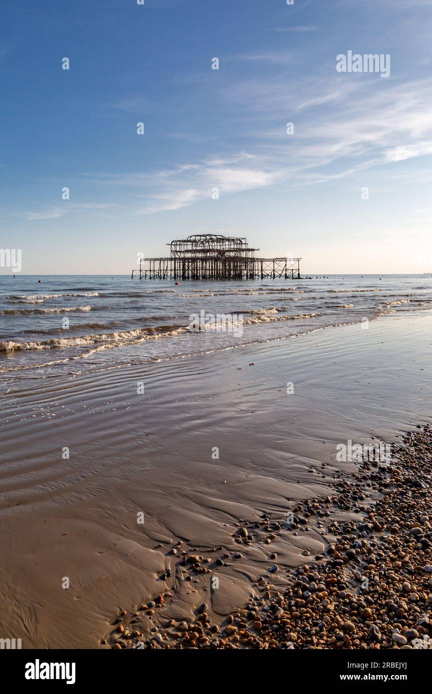 Low tide at the Brighton coast revealing a sandy beach, with the old ...